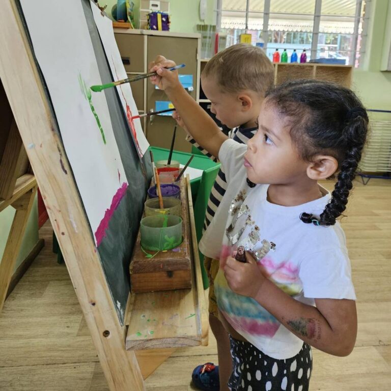 Painting at the Easel - Montessori Life
